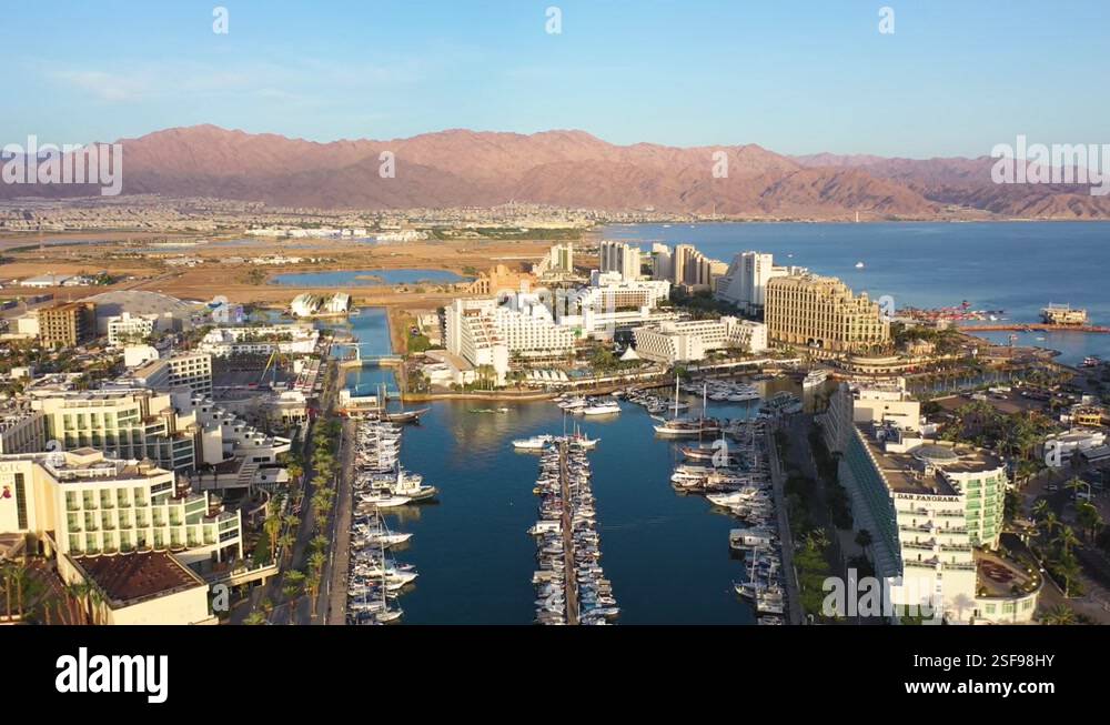 Multiple boats and sailing vessels moored across from each other in the ...