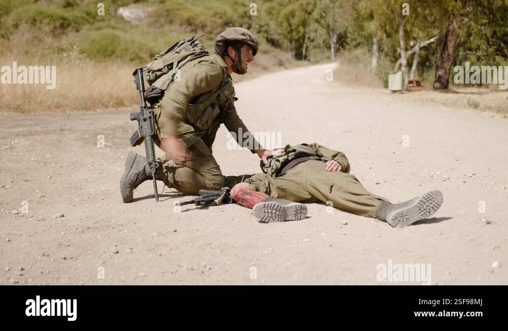 Soldier runs off to a ditch while leaving his armed, seriously injured ...