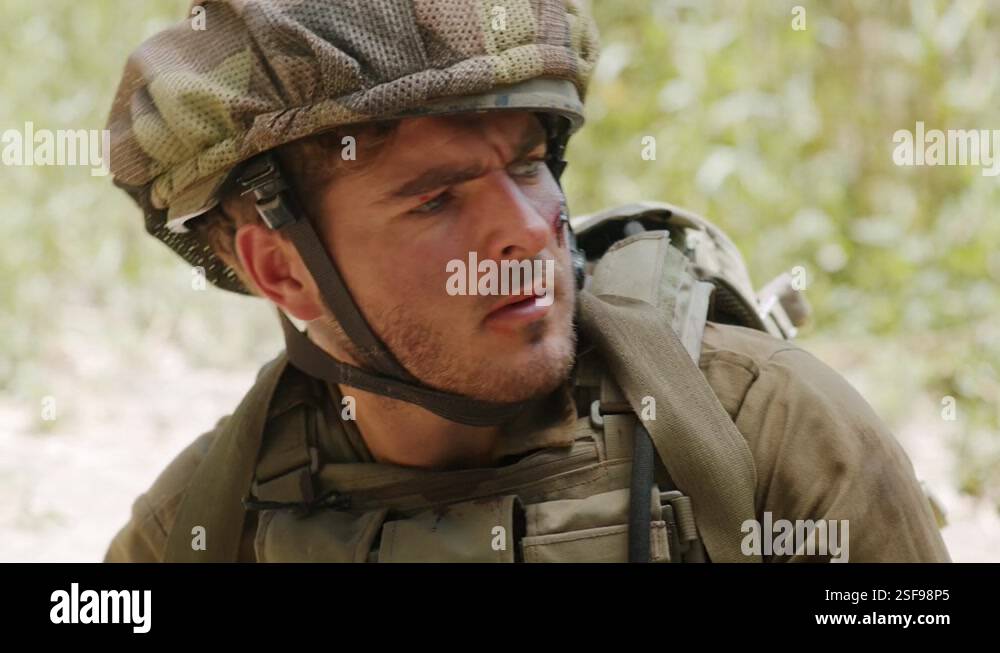 Soldier looks around where to go as he boldly talks to his colleague in ...