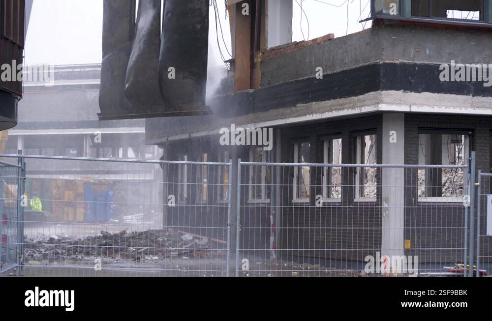 Demolition of a building using building hydraulic shears Stock Video ...