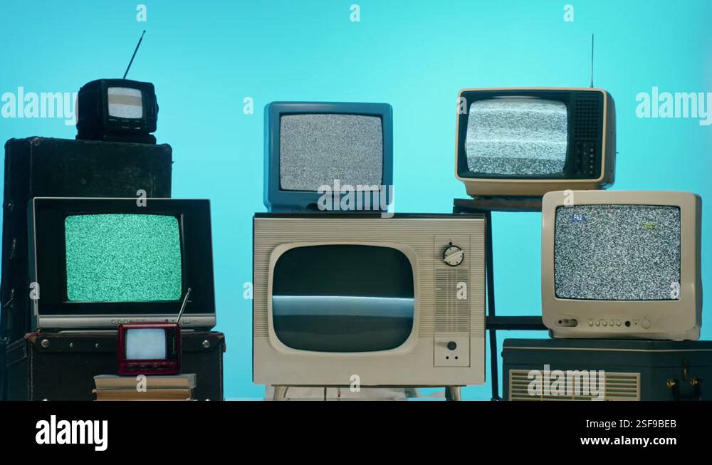 Old televisions with grey interference screen on blue neon background ...
