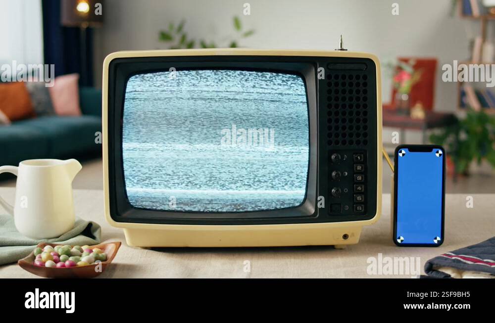 Old television with grey blank screen on home background living room ...