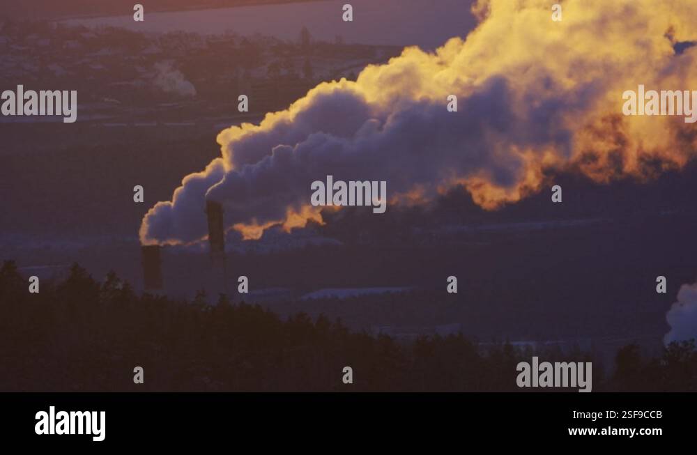 Billowing steam from smoke stack filling sky, super slow motion close ...