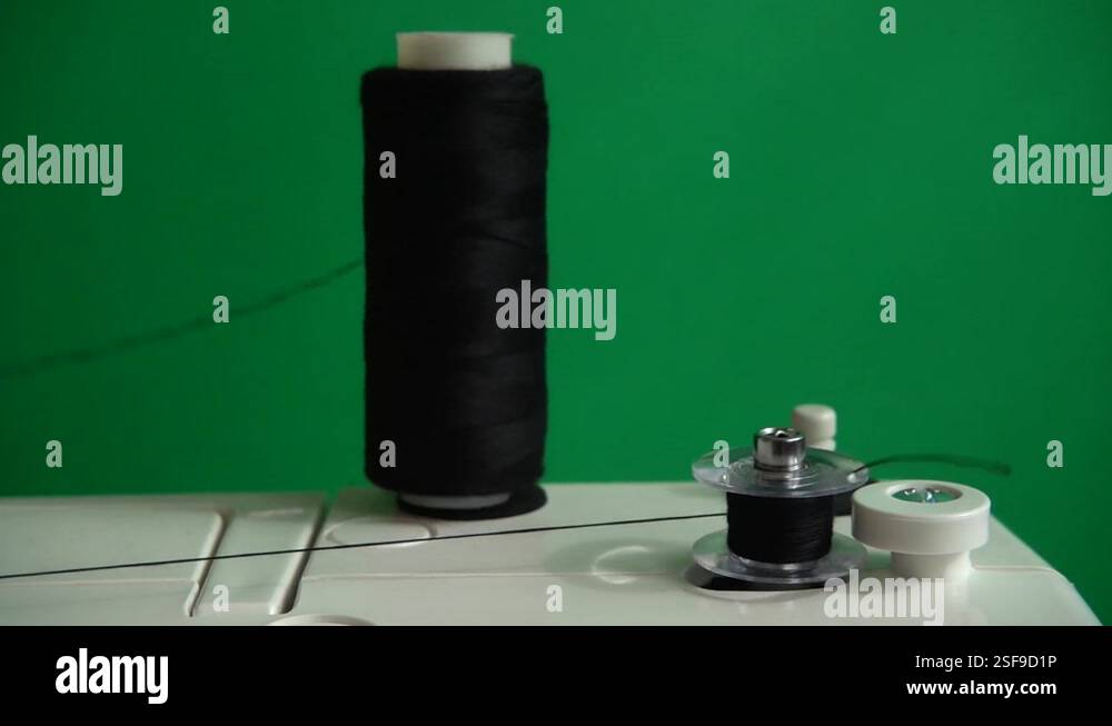 Sewing machine winding thread onto a spool. Slow motion Stock Video ...