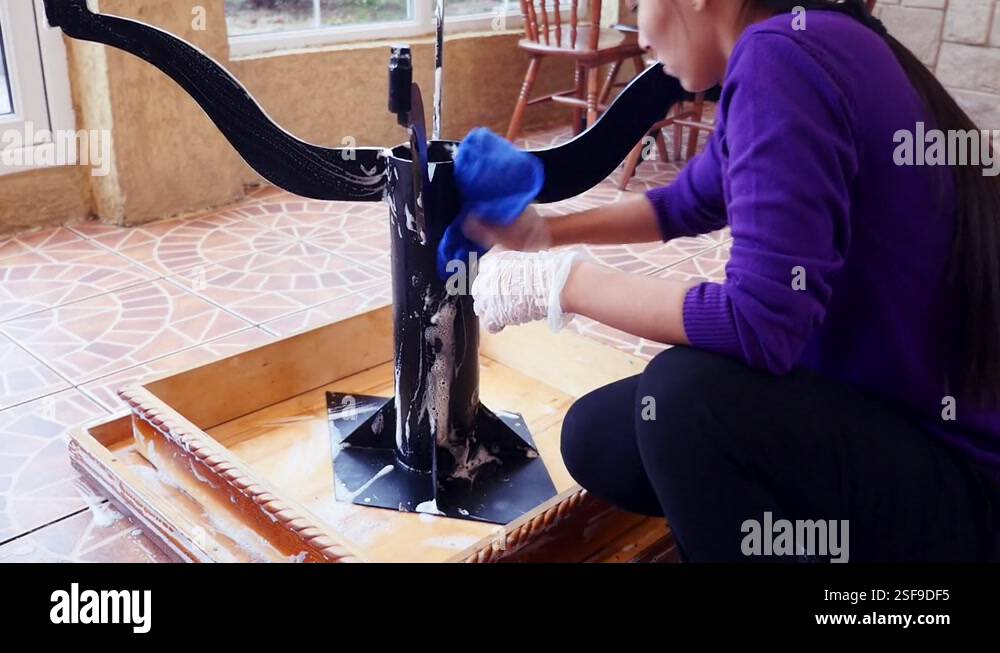 overturned the table and washes the iron black legs of the table in ...