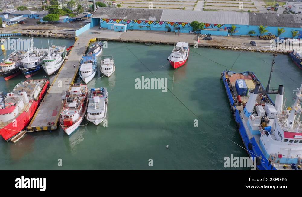 Freight import and export vessels anchored in Caribbean port; Puerto ...