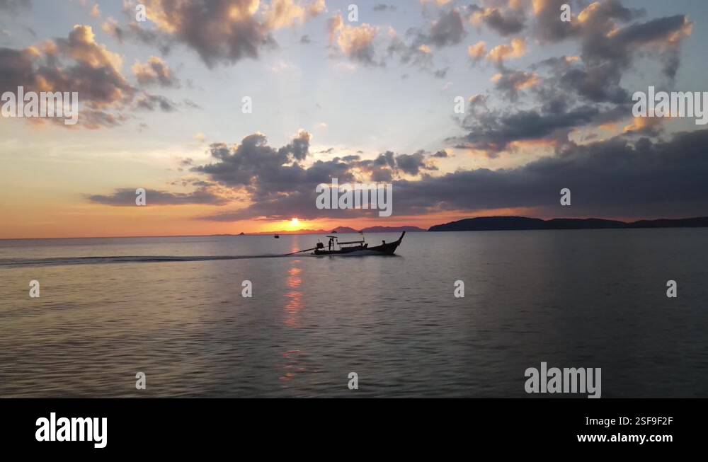 Traditional boat sailing at high speed through the sea with a beautiful ...