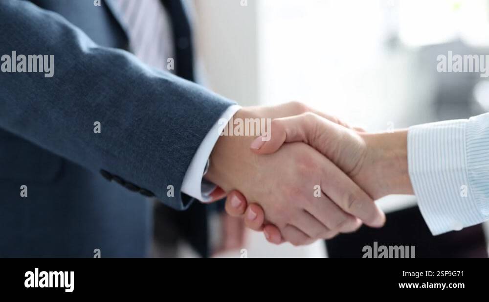Closeup of business partners shaking hands in office 4k movie slow ...