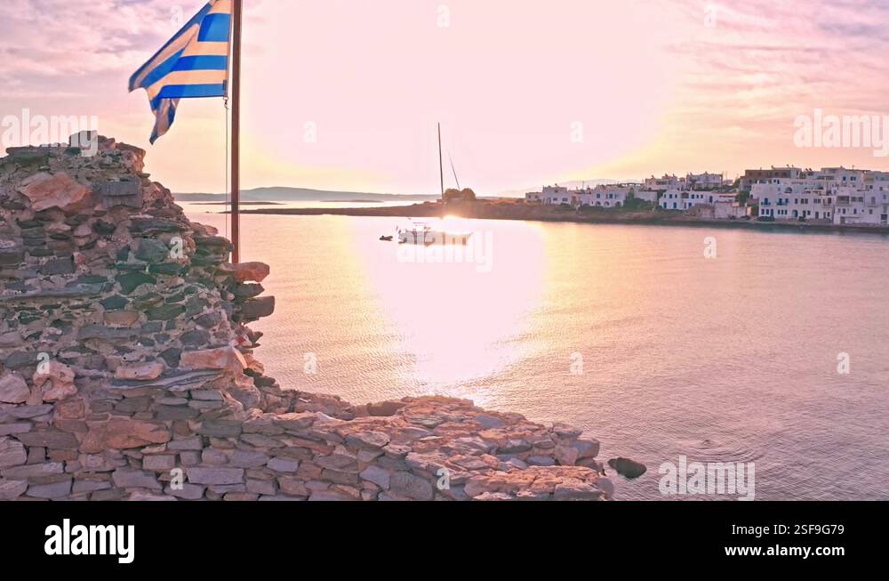 Greece country flag at sunrise over Paros island in Aegean sea of ...