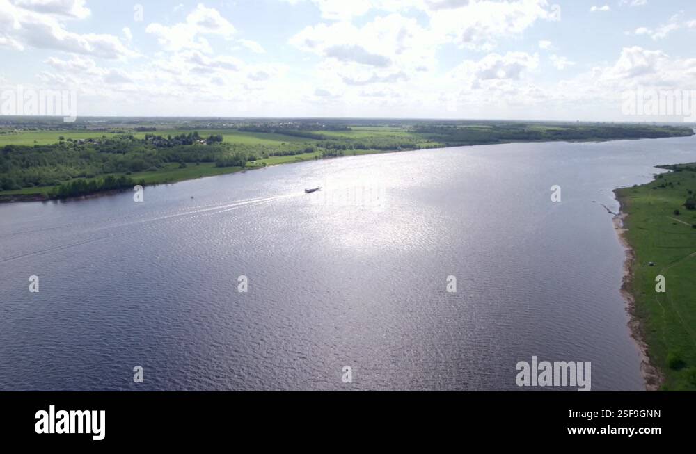 Small water jet propulsion ship is passing river banks on a water ...