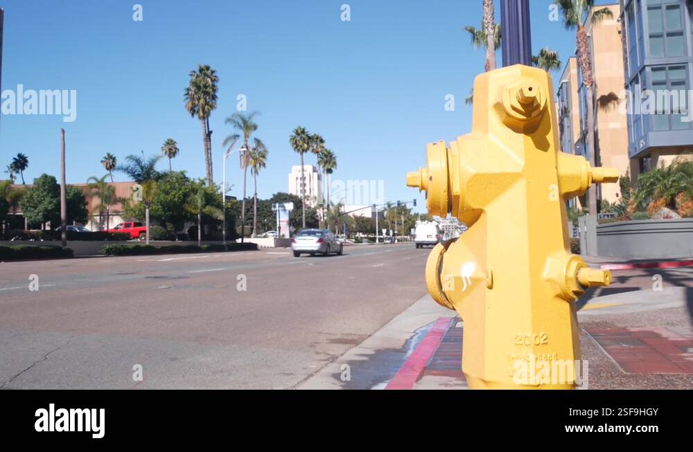 Yellow fire hydrant extinguisher on city street, California fire ...