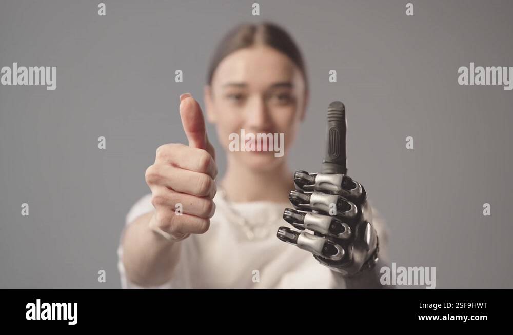 Woman with Bionic Arm Showing Thumbs Up Stock Video Footage - Alamy