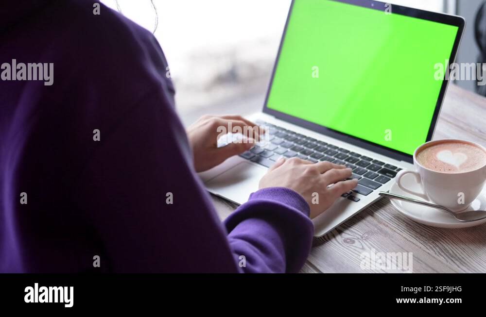 Woman using laptop notebook viewing green screen press browsing chroma key Stock Video Footage ...