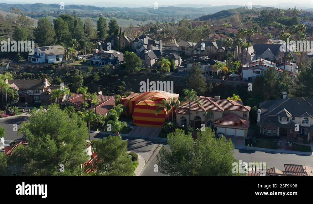Aerial approach of a large house that has been tented for termites in ...