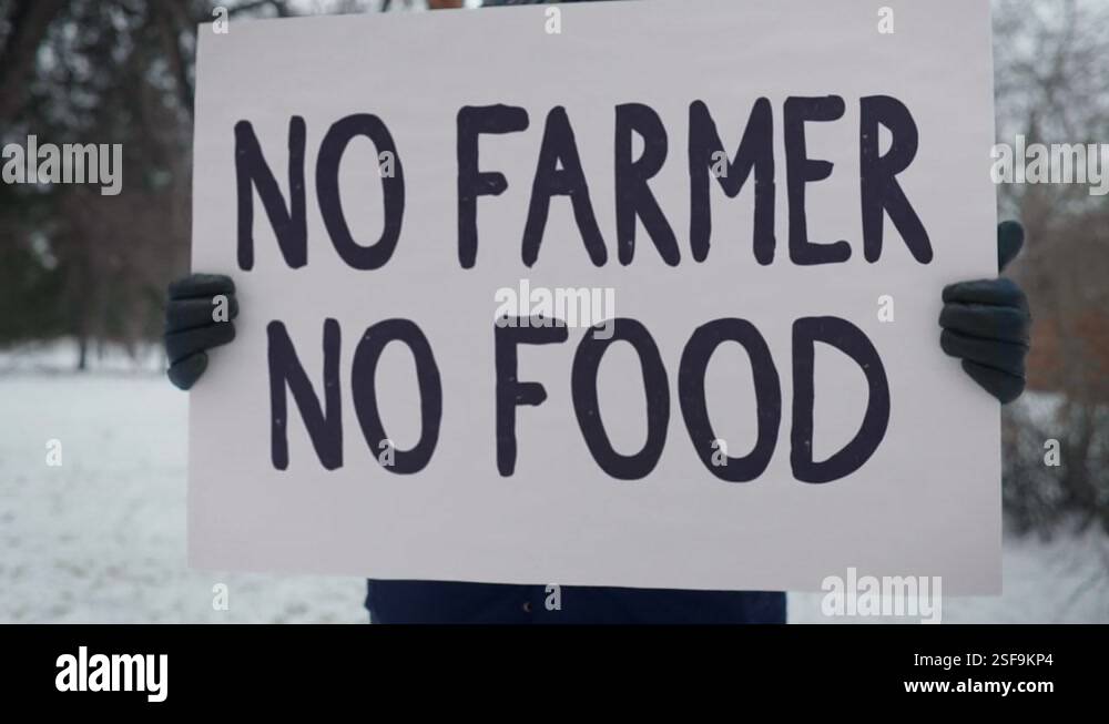 Protester in a Strike action against injustice with a banner No Farmer ...