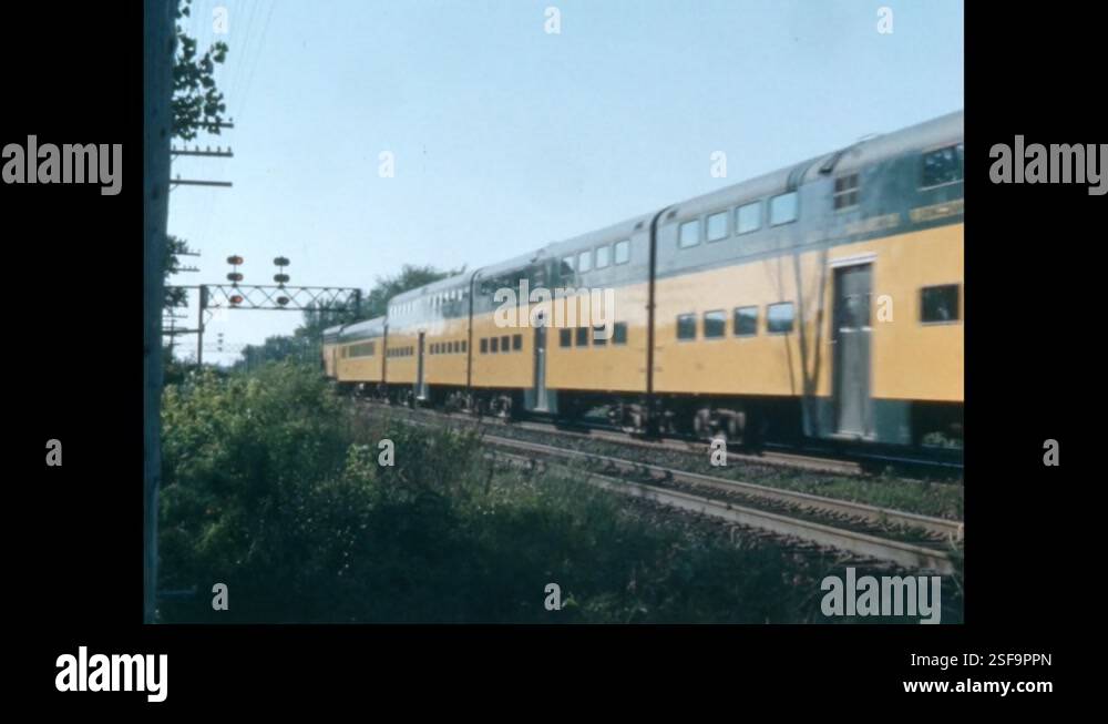 1960s: Train passing on tracks. Clapboard. Boy looking at thermometer ...