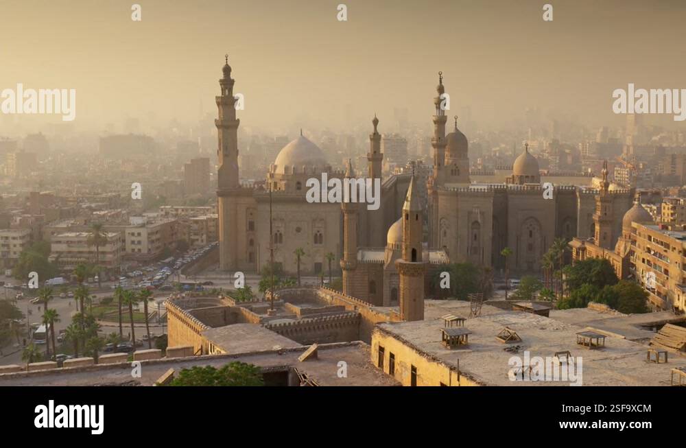 Zoom out of Mosque of Sultan Hassan, Cairo, Egypt at sunset. Cairo city ...