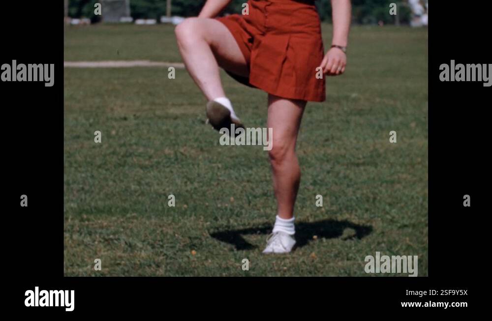 1940s: Girl makes kicking motion with leg in slow motion. Girl kicks up and Stock Video Footage ...