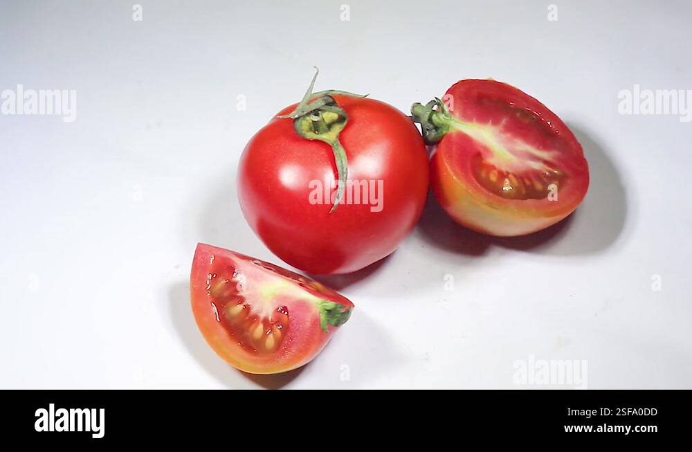 Tomato and its slice on a white background rotate 360 degree with ...