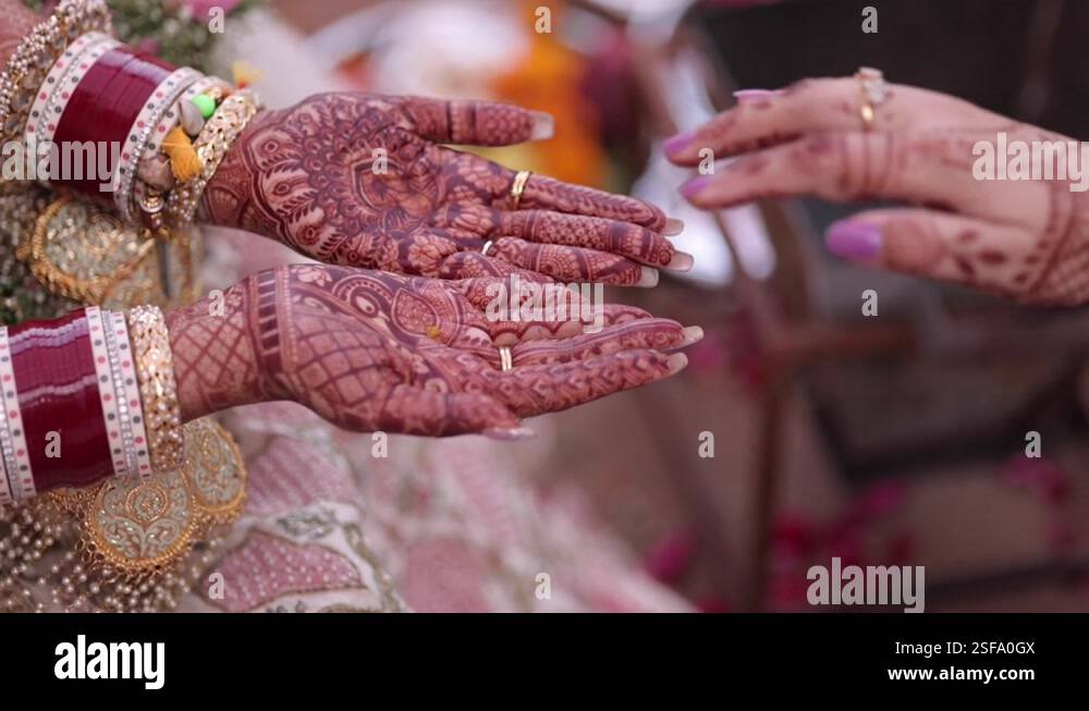 Shot of an Indian Bride and Indian Groom doing Puja at their Indian ...