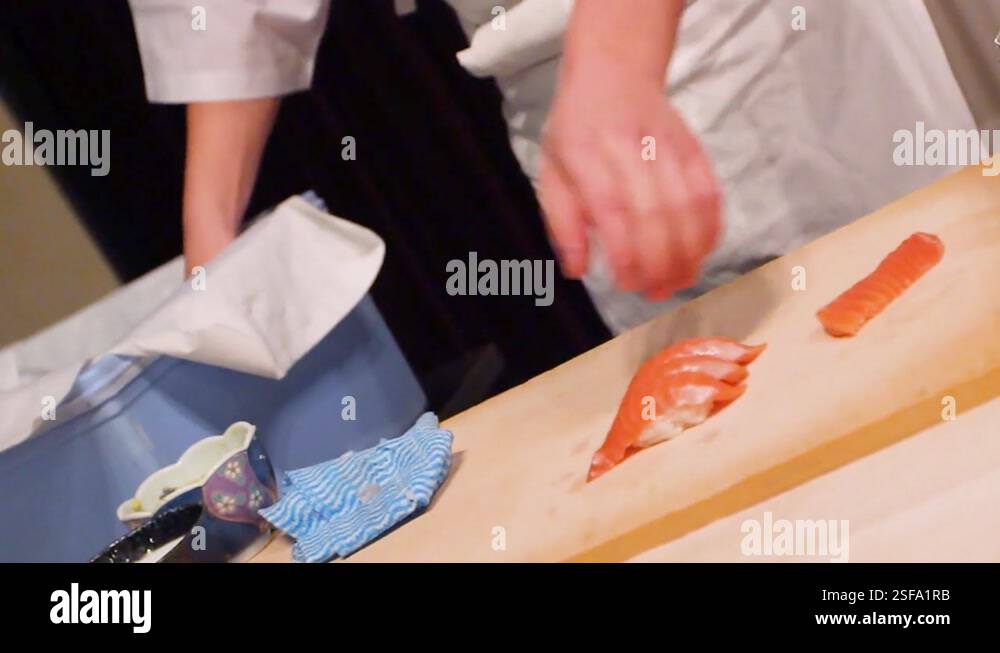 Chef making sushi sashimi nigiri. Master class. Professional chef is ...