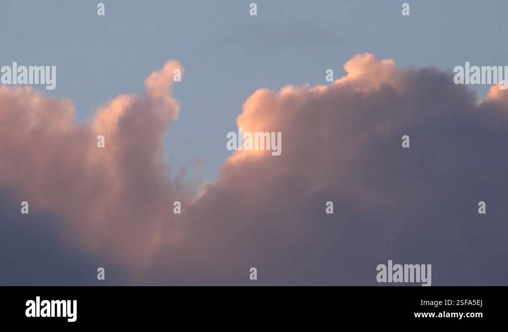 Clouds time lapse from dark to light blue sky lifting sun 4K Stock Video Footage - Alamy