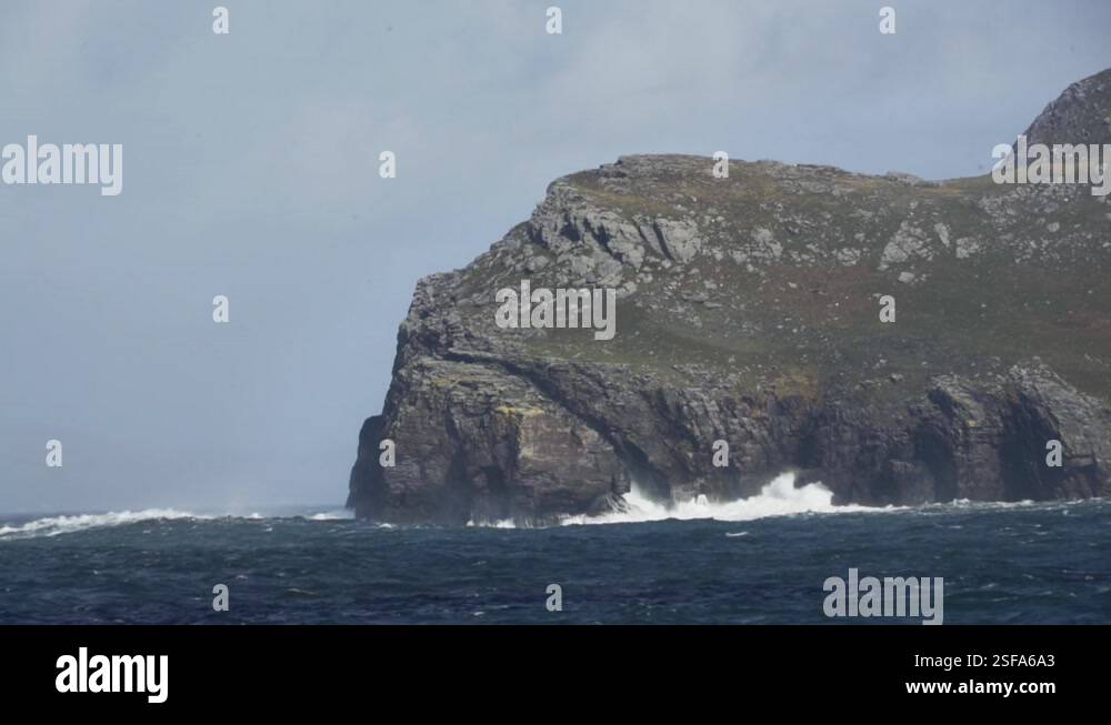 Slow motion landscape waves crash against Irish Cliffs Stock Video ...