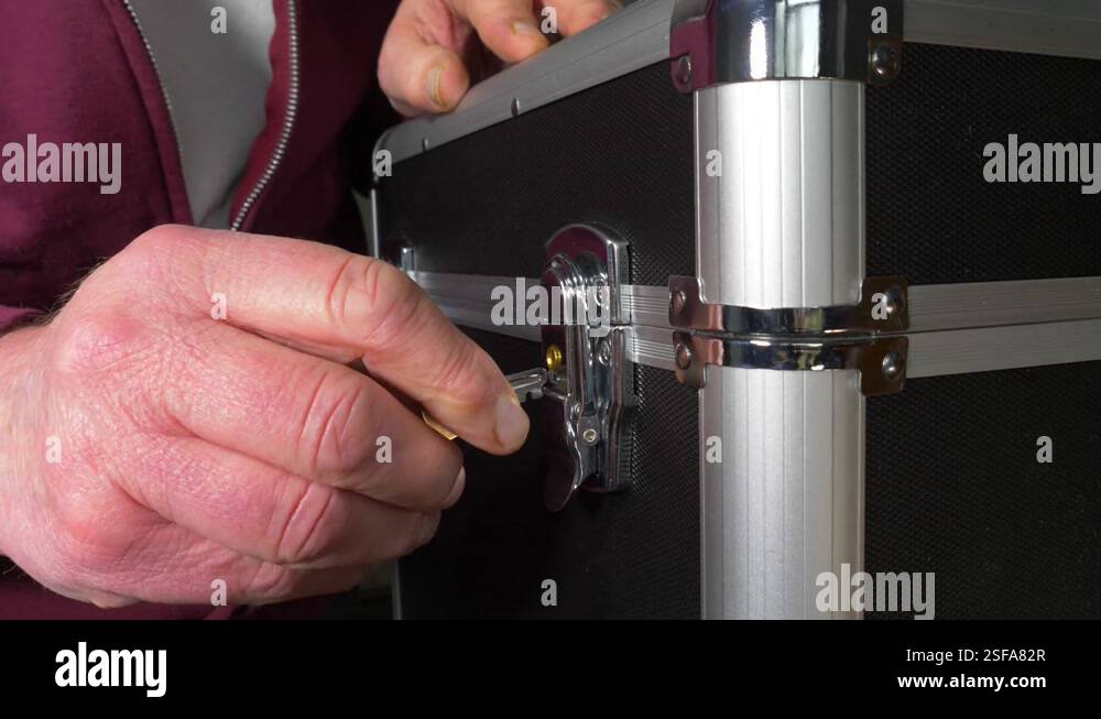 Man locking a latch on a protective storage case Stock Video Footage ...