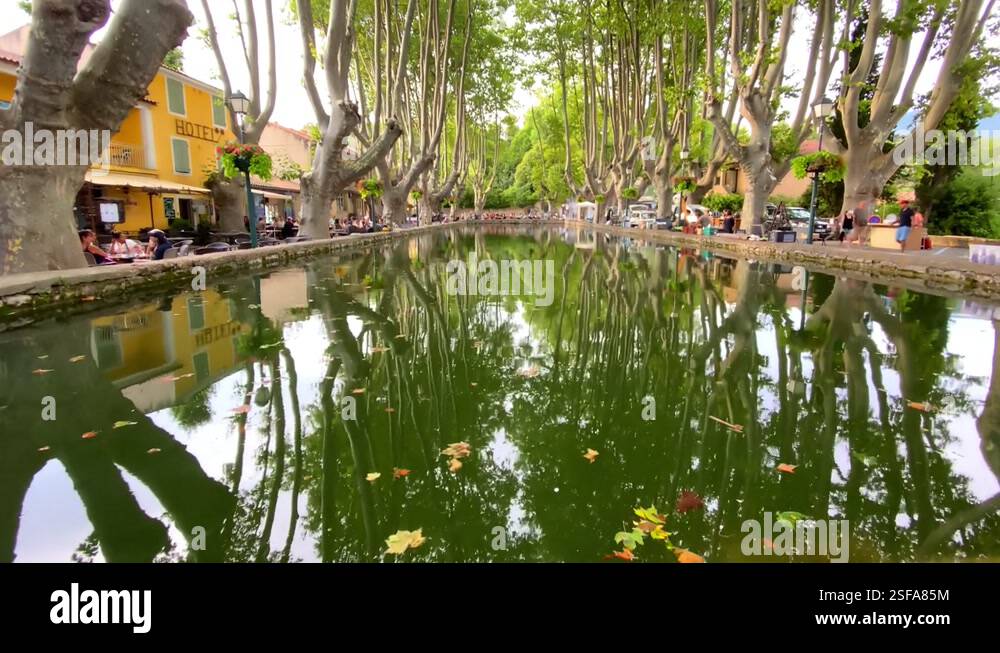 L'étang, a large basin of water in the main square of the village of ...