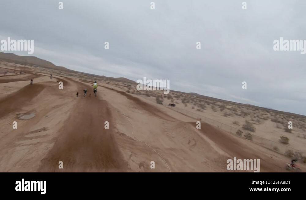 Motorcycles racing on an off-road racetrack in the Mojave Desert ...