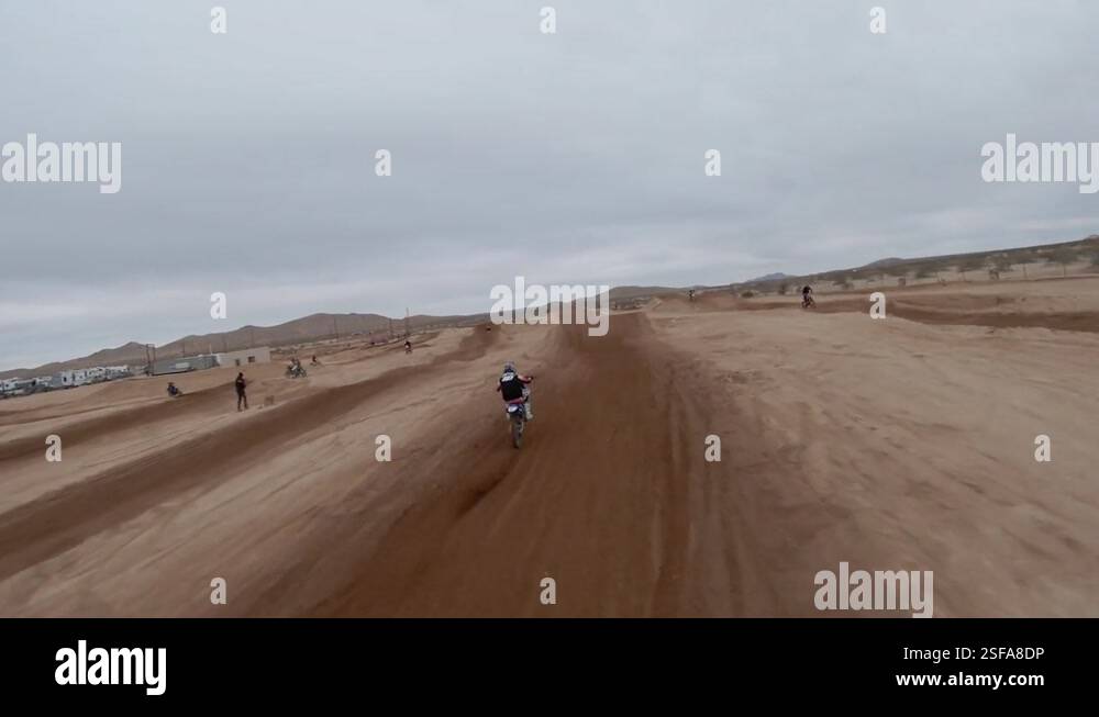 Amazing high-speed race on dirt bikes around a track in the Mojave ...