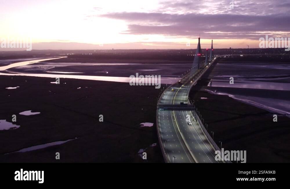 Mersey Gateway illuminated toll bridge crossing aerial view during ...