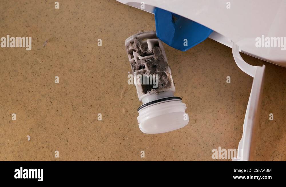 Dirty and clogged washing machine pump filter removed no people Stock ...