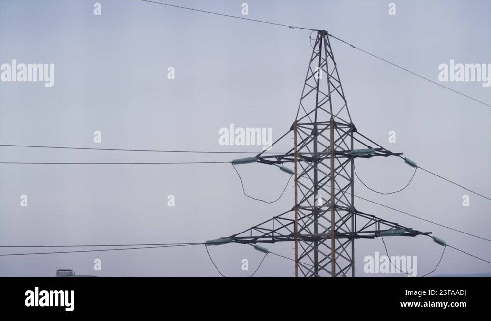 High voltage power pylon at clear sky drone shot. Parts of electrical ...