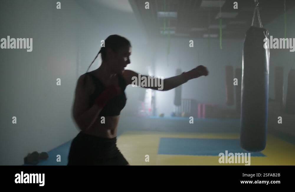 Blurred view, female fighter trains his punches and defense in the boxing gym Stock Video ...