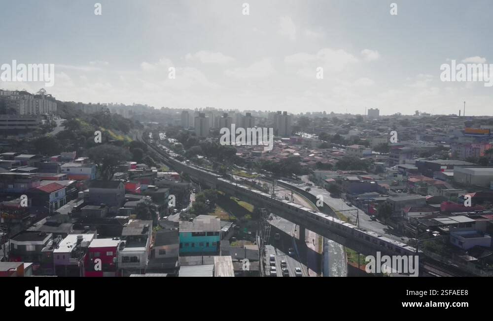 Aerial landscape image - Flying over slum subway rail in district of ...