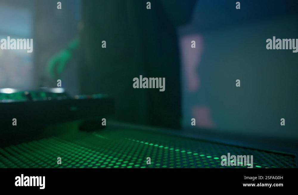 Deejay coming up to desk, taking headphones, putting it to ear and ...