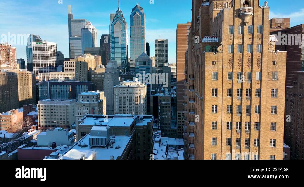 Rising reveal of sky skyline. Skyscraper towers in fresh winter snow ...