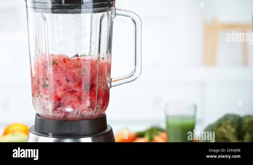 Super slow motion of mixing pieces of vegetables in blender Stock Video ...