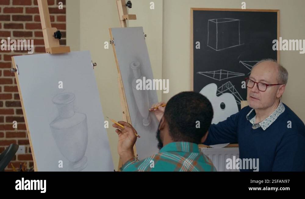 Team of students drawing vase model on canvas in art class Stock Video ...