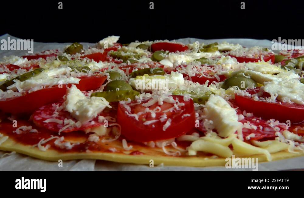 Spinning pizza with mozzarella cheese, olives, pickled Stock Video ...