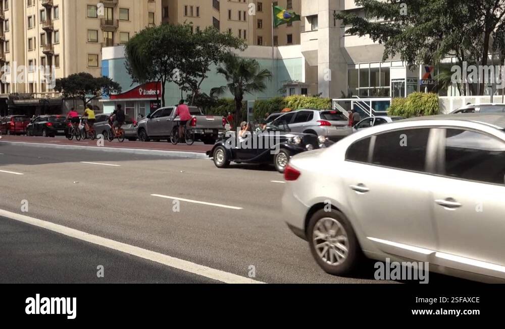 Classic Sports Cars Driving On The Street In Sao Paulo, Brazil With ...
