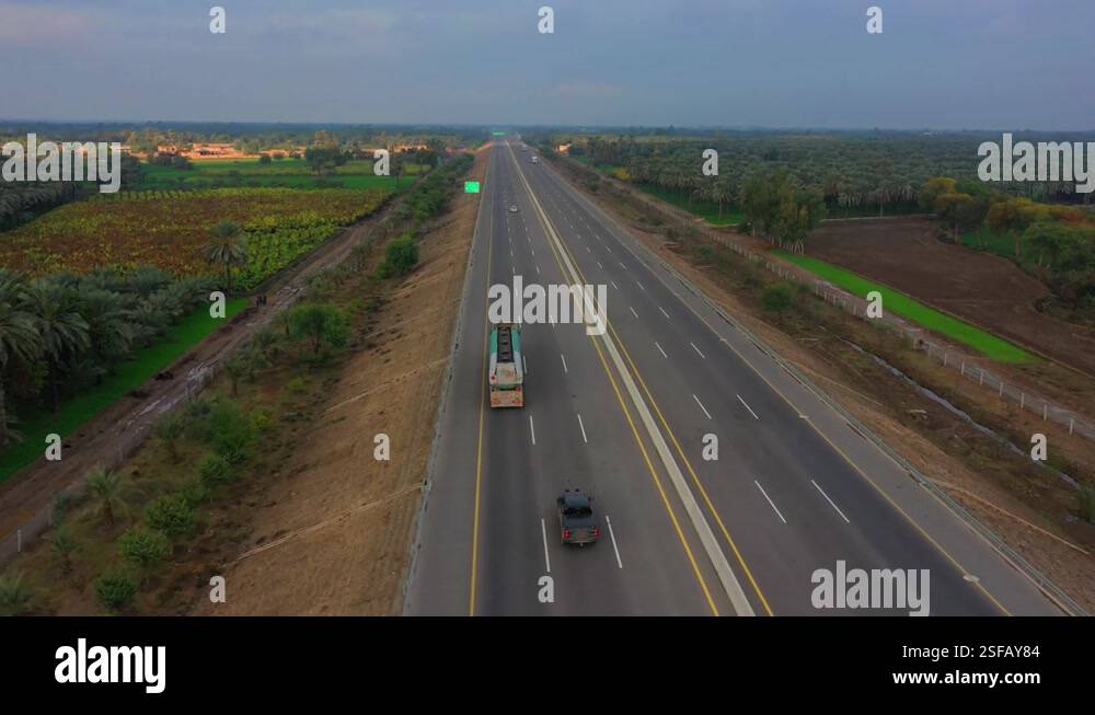 Aerial Flying Over Motorway In Sindh With Traffic Going Into Horizon ...