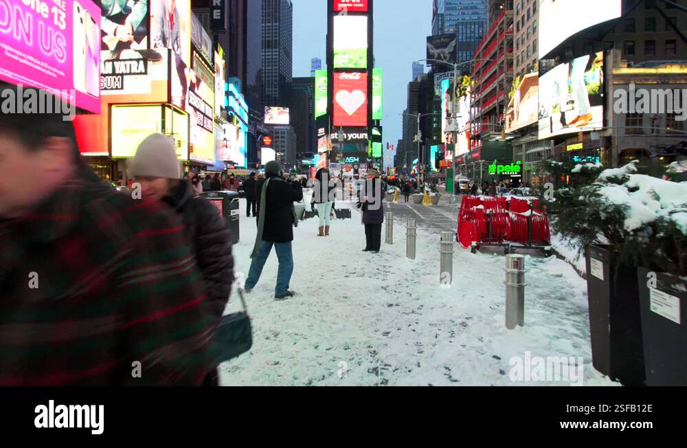 Times Square, skyscrapers and walking people.Everything is illuminated ...