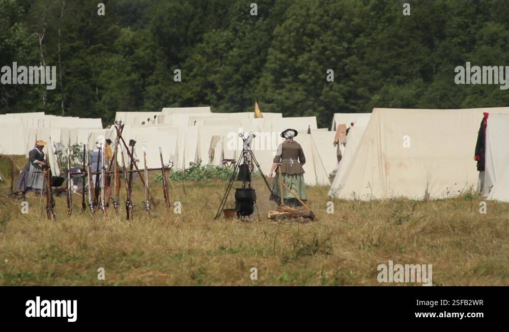 Re-enactment Soldier Camp with canvas tents, campfires, soldiers ...
