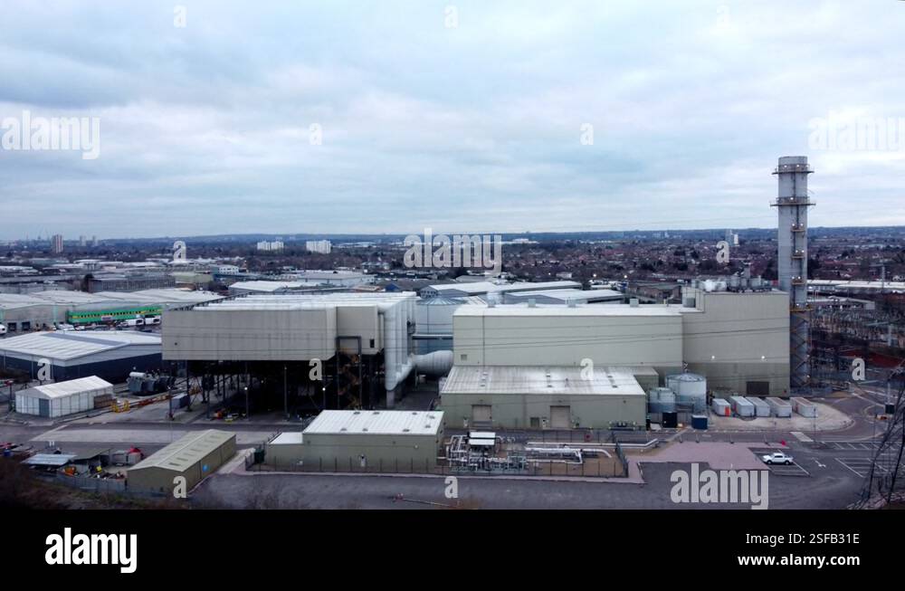 An aerial view moves towards the Enfield gas-fired power station and ...