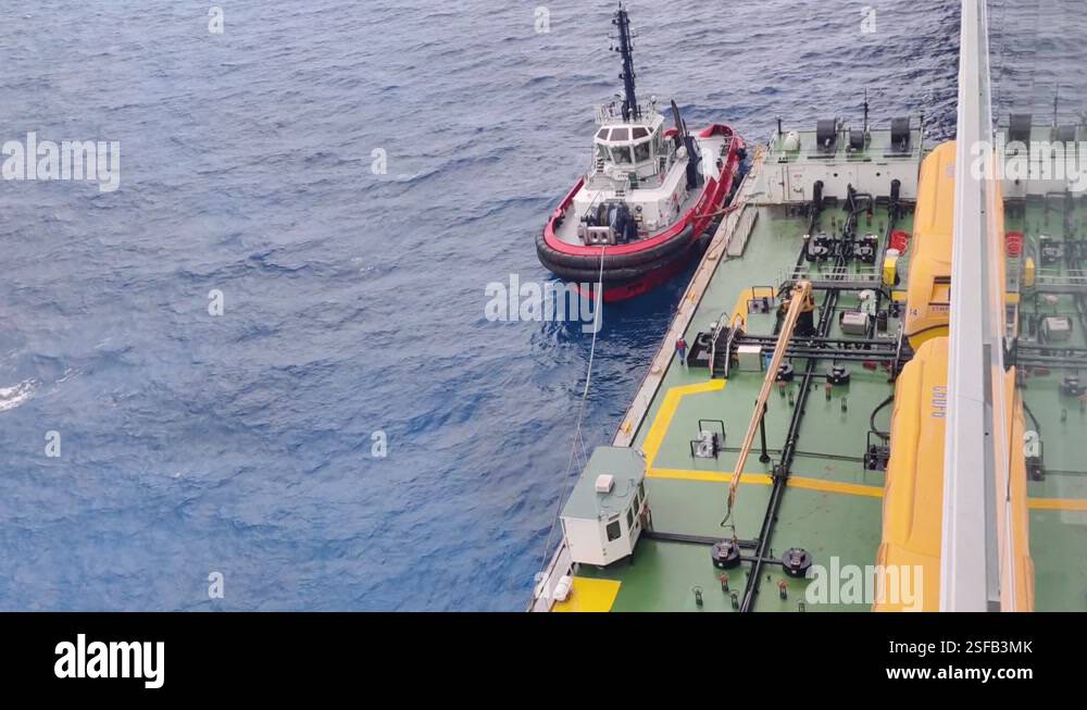 Huge oil bunkering ship sticked to the luxury cruise ship and fueling ...