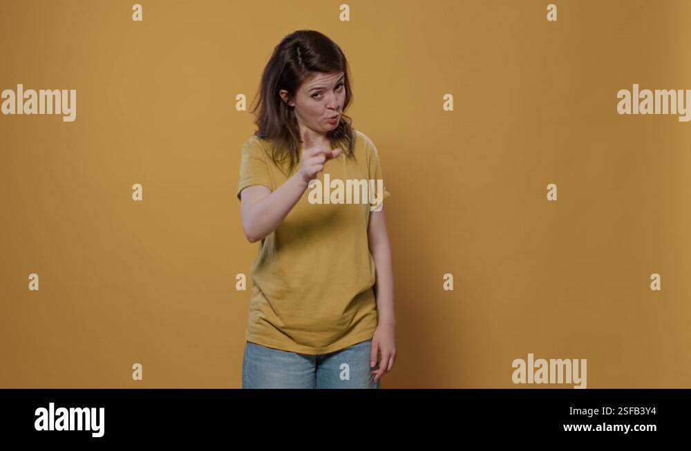 Angry upset woman arguing showing index finger pointing at guilty ...