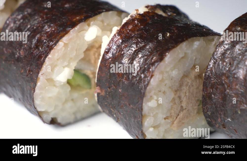 Macro shot of tasty Sushi filled with rice and tuna lighting in Stock ...