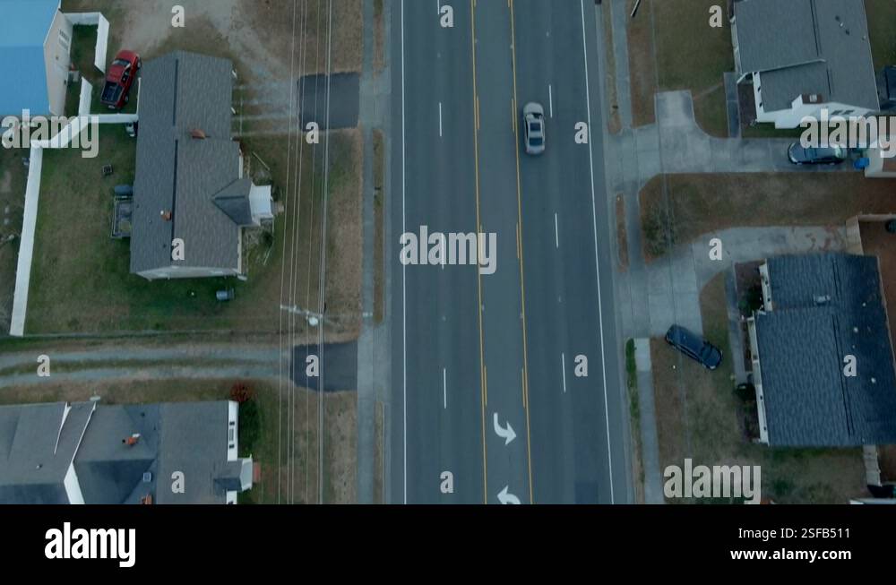 Car Traffic Commuting On Multi Lane Road Between Suburb Houses, Aerial ...